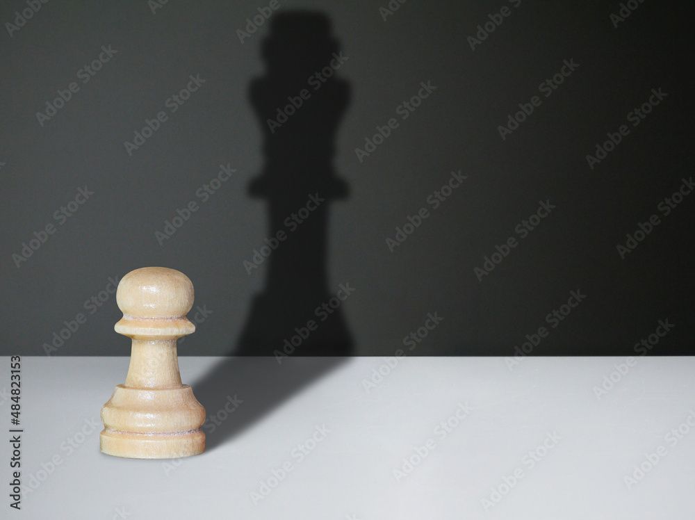 leadership - pawn forming king shadow Stock Photo | Adobe Stock
