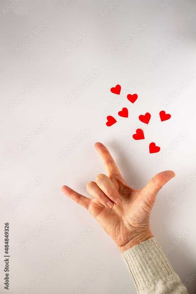 The phrase I-Love-You in sign language, the language of the deaf. Woman ...