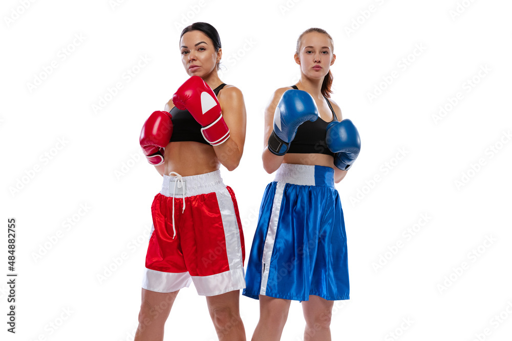 Two young beautiful girls, professional boxers in boxing shorts and ...