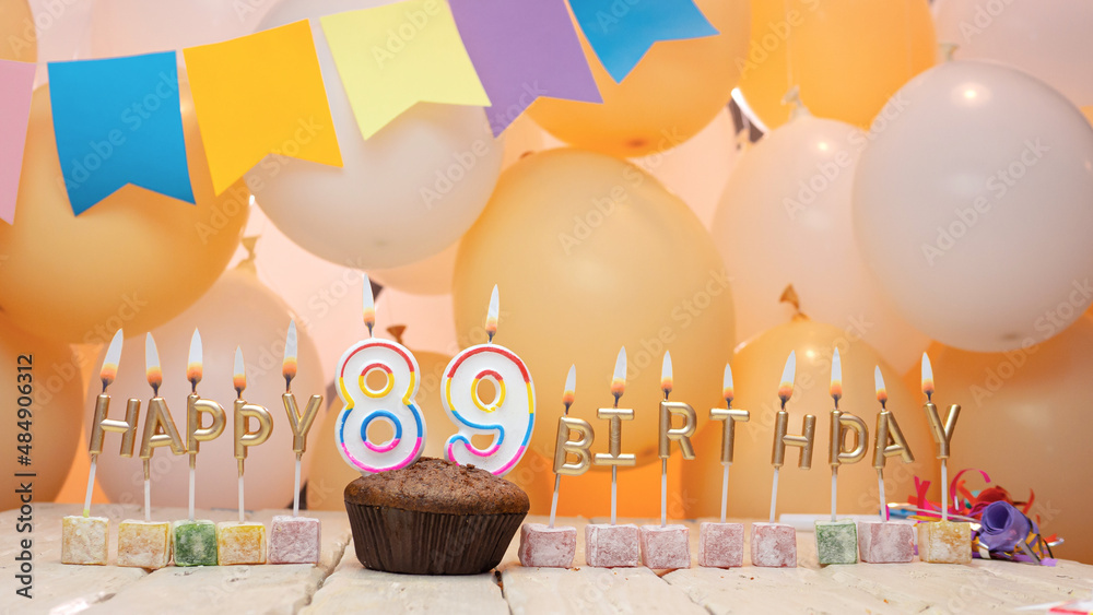 Happy birthday greetings for 89 years from gold letters of candles ...