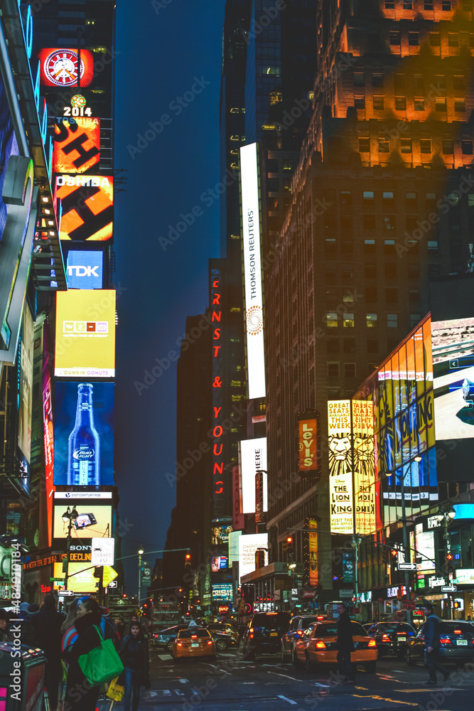 Neon advertising and night lights on Times Square. Times Square is a ...