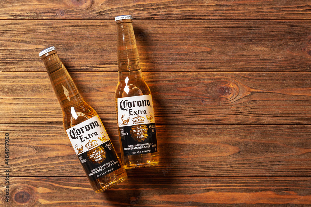 Two bottles of Corona Extra beer on a wooden background with copy space Stock Photo | Adobe Stock