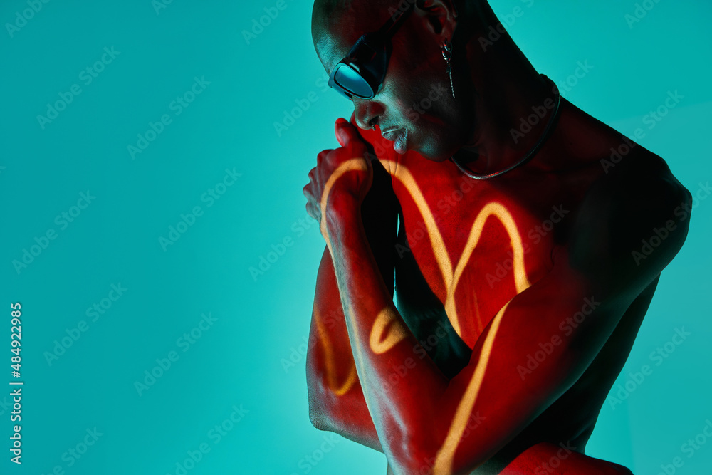 Stylish shirtless black man under lights Stock Photo | Adobe Stock