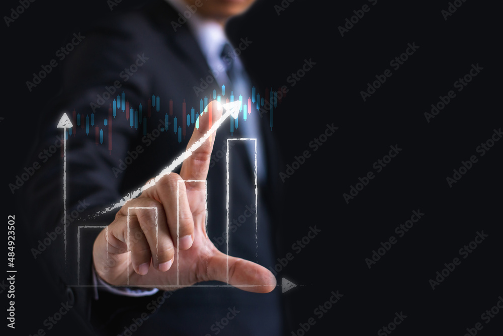 Businessman using finger touch symbol stock graph and chart background ...