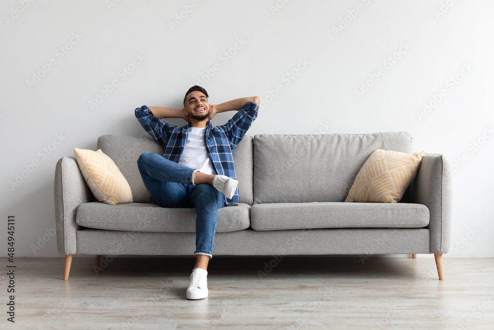 Man having rest at home on the couch Stock Photo | Adobe Stock