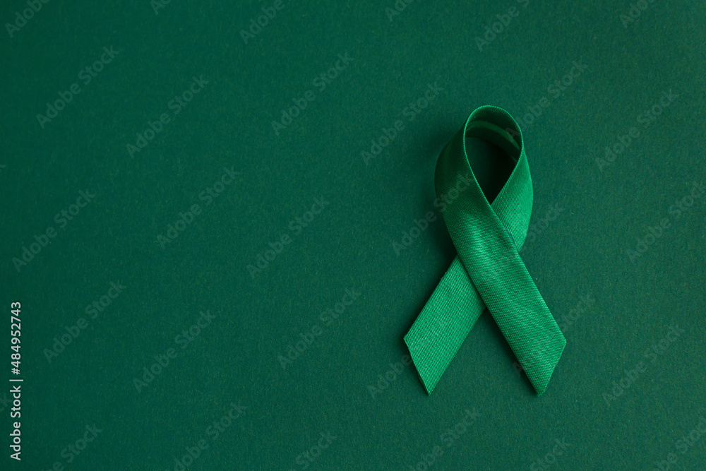 World bipolar day. Green ribbon on green background. Mental health ...