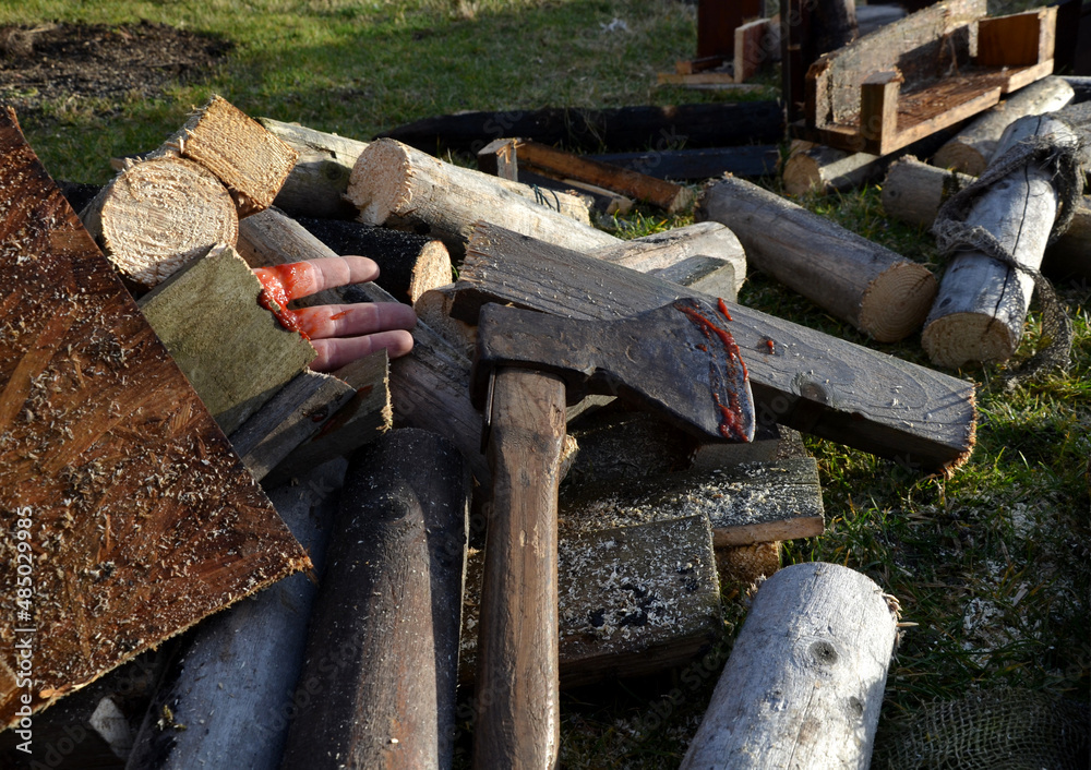 man injured with ax while working with wood for heating. blood and ...