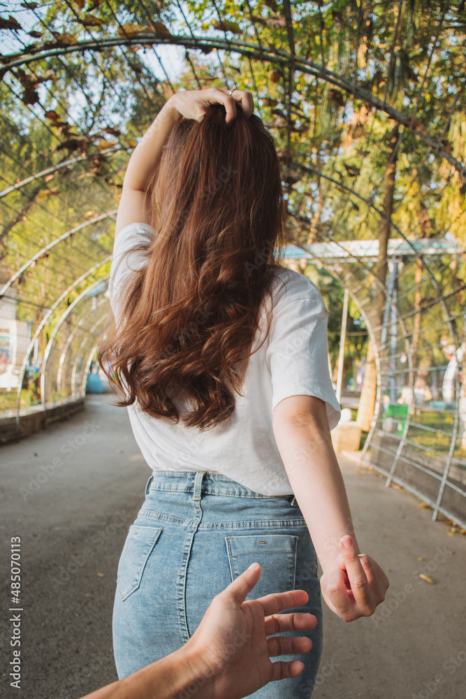 A young angry woman is walking away and show middle finger indecent ...