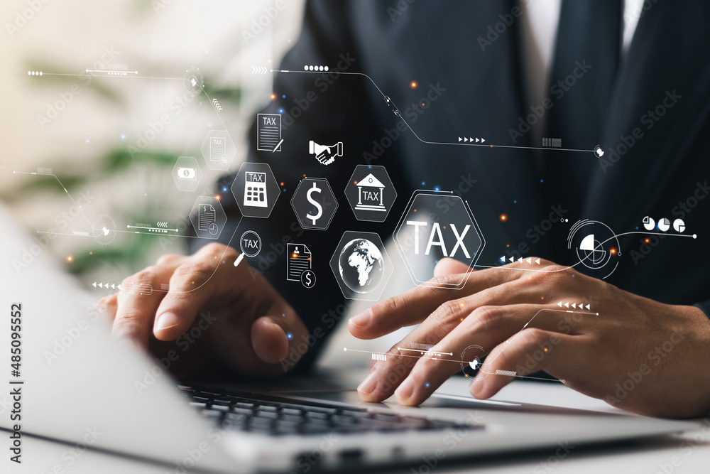 Businessman using his laptop computer to fill out online personal ...