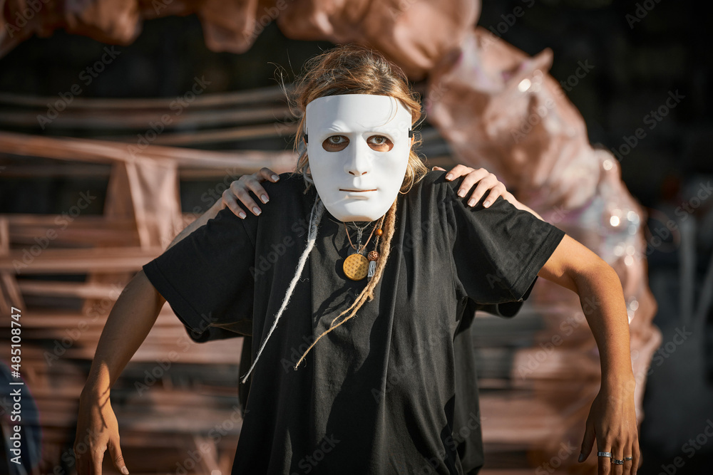 Two girls acting in white theater mask, outdoor art theatrical ...