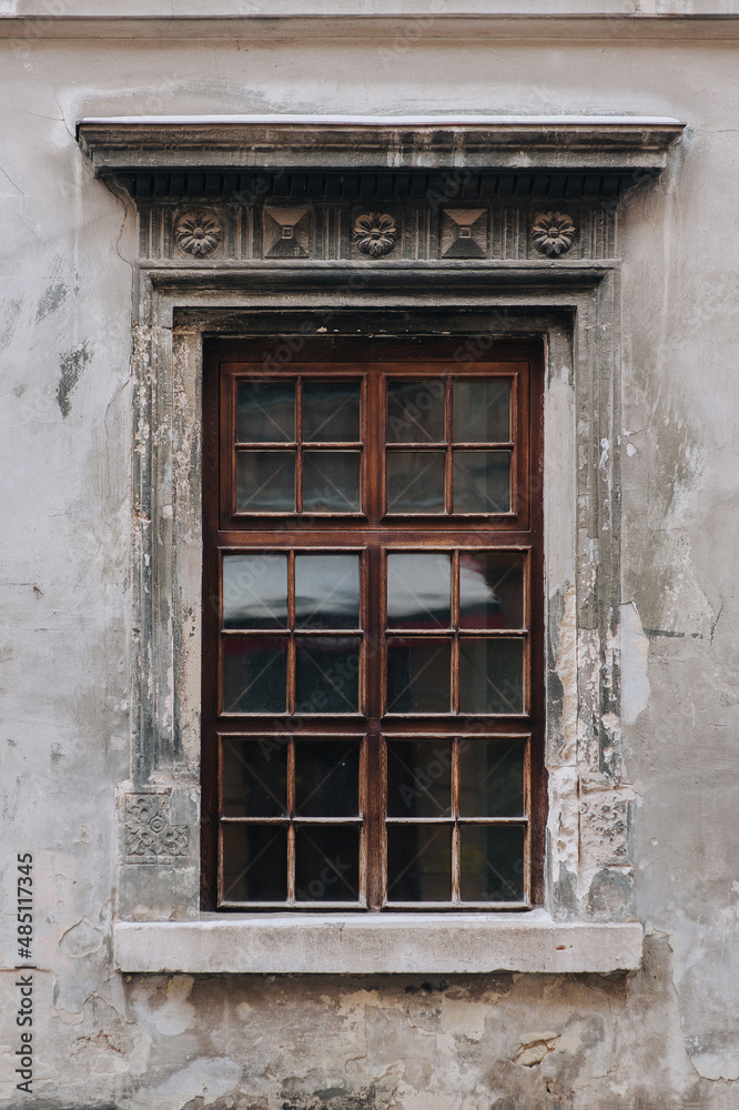 Vintage old dark brown wooden window with square glass and carved ...