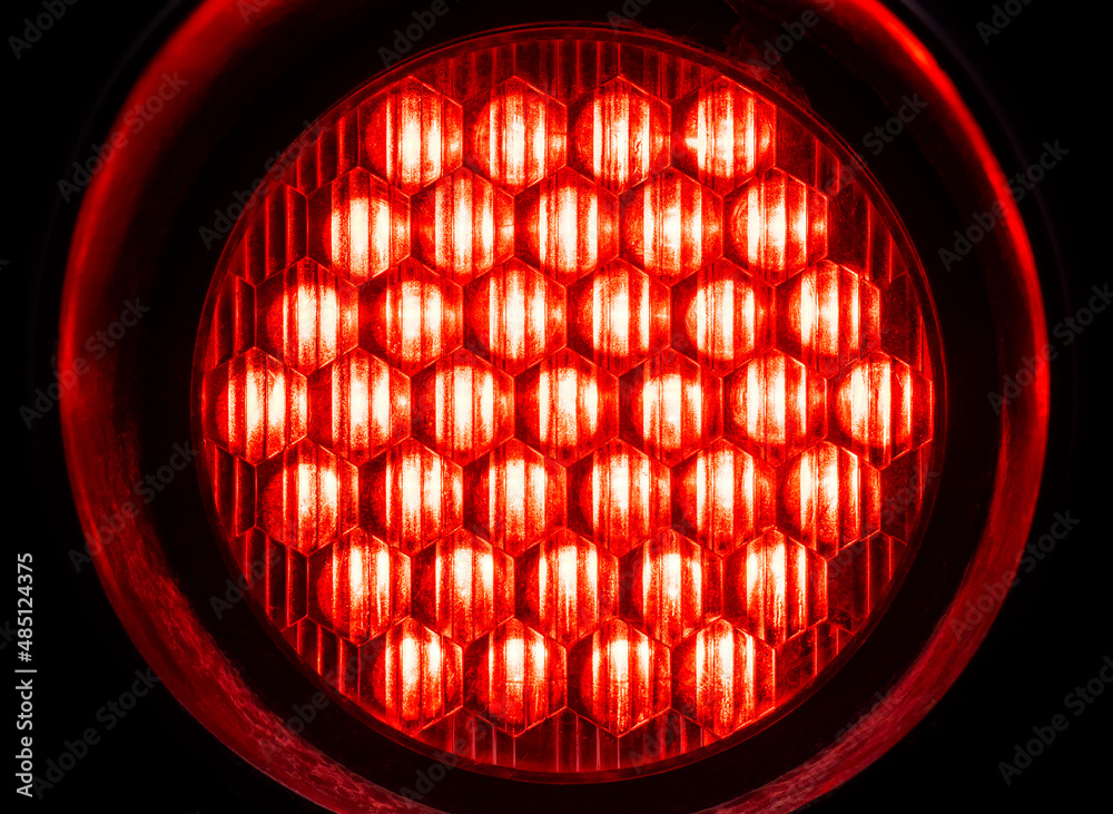 Bright round red light in the dark, object macro, detail, closeup ...
