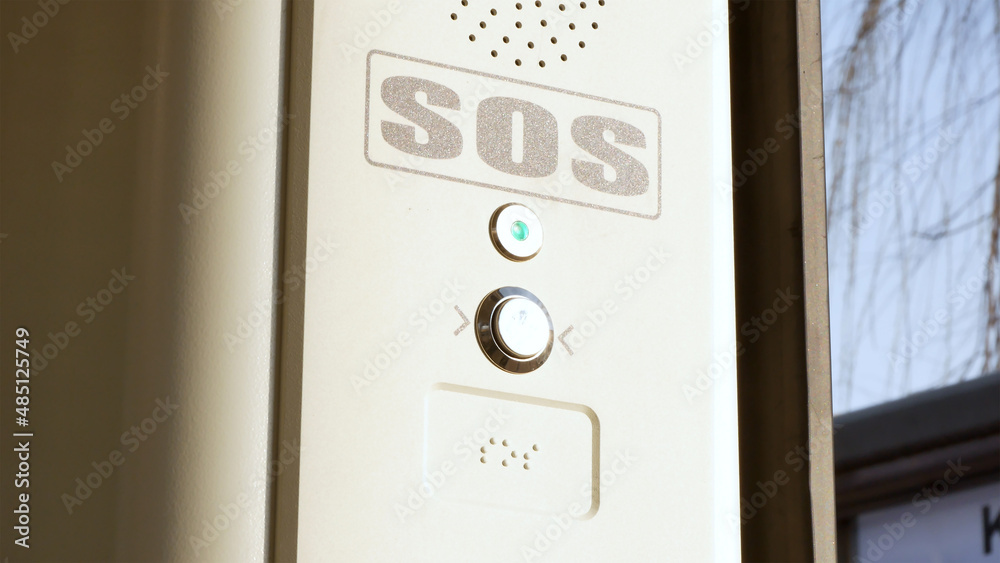 SOS signal button inside the tram, train, emergency help system push ...
