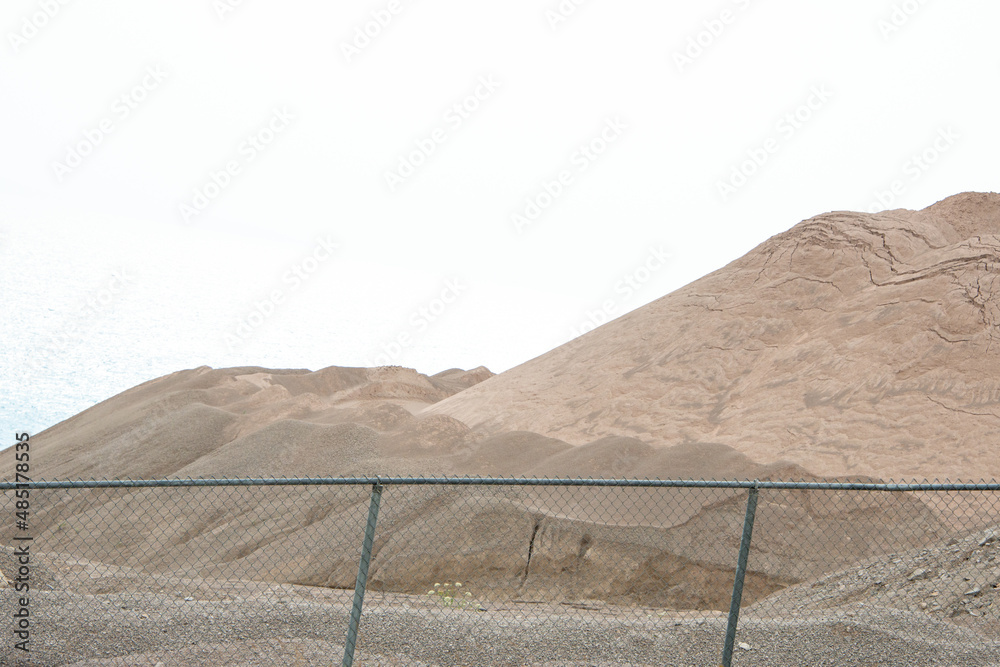A stockpile of limestone mined in an above ground quarry. The beige ...