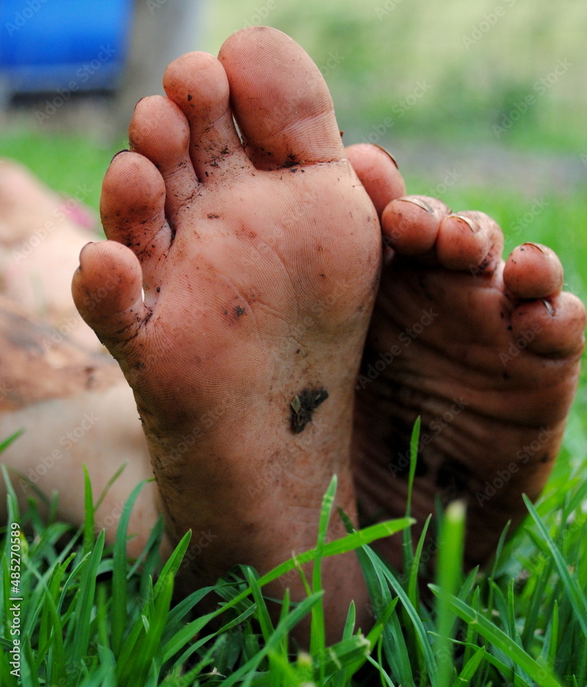 feet in the grass Stock Photo | Adobe Stock