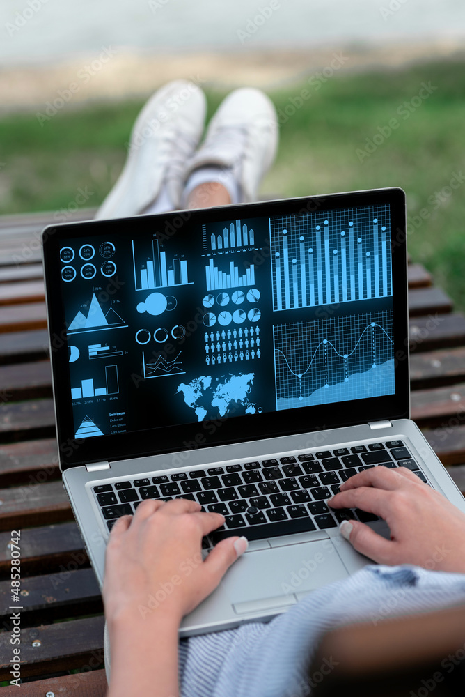 Laptop Resting On Lap Of Woman With Cross Leg Outdoors Accomplishing ...