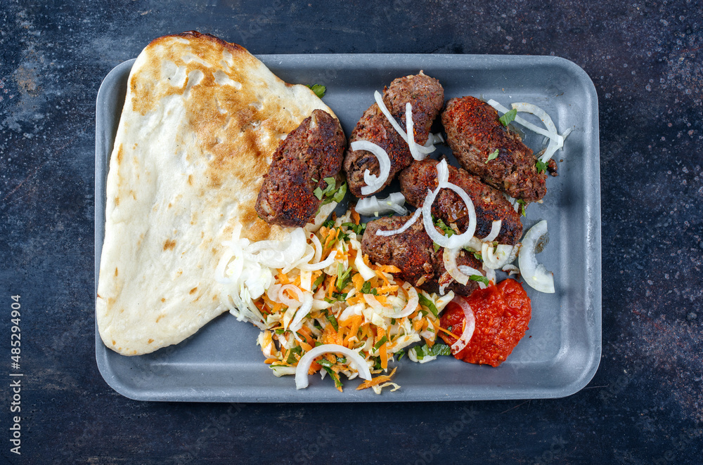 Traditional Croatian cevapi spicy meat ball rolls with cabbage carrot ...
