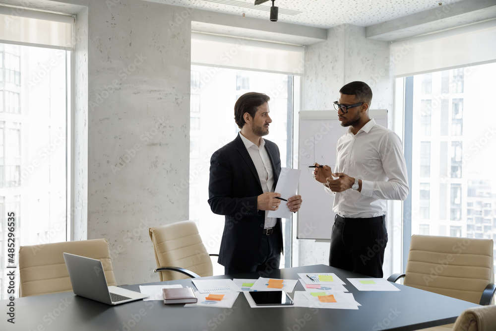 Diverse boss and manager discussing sales result, project reports ...