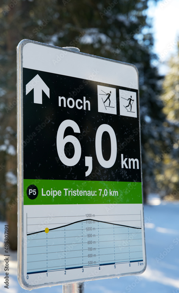 Road sign that indicates the length and height difference of a cross ...