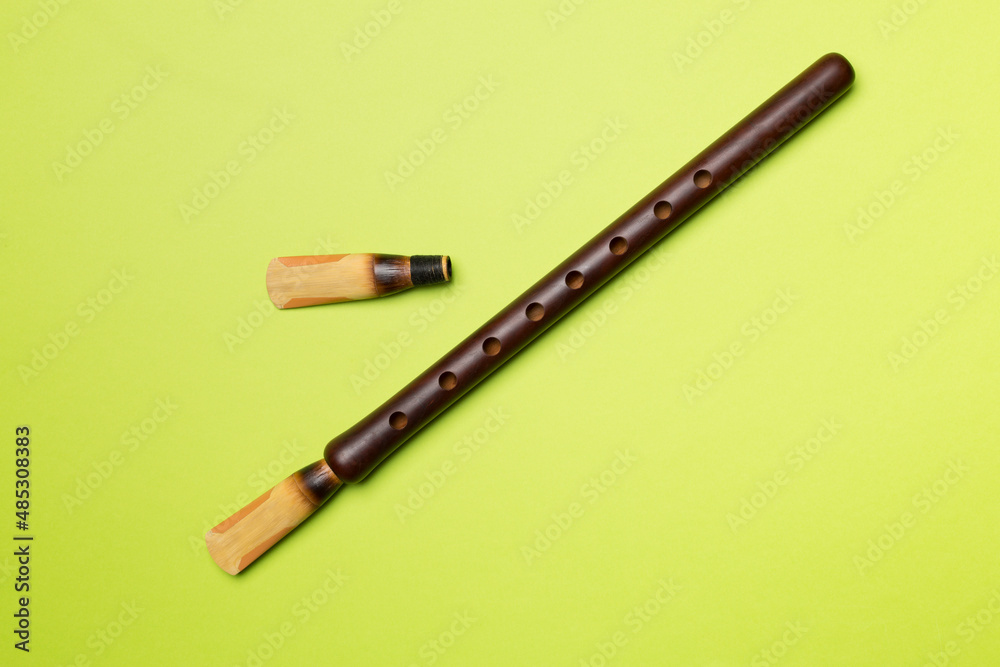 Armenian national musical instrument duduk on color background. Top ...