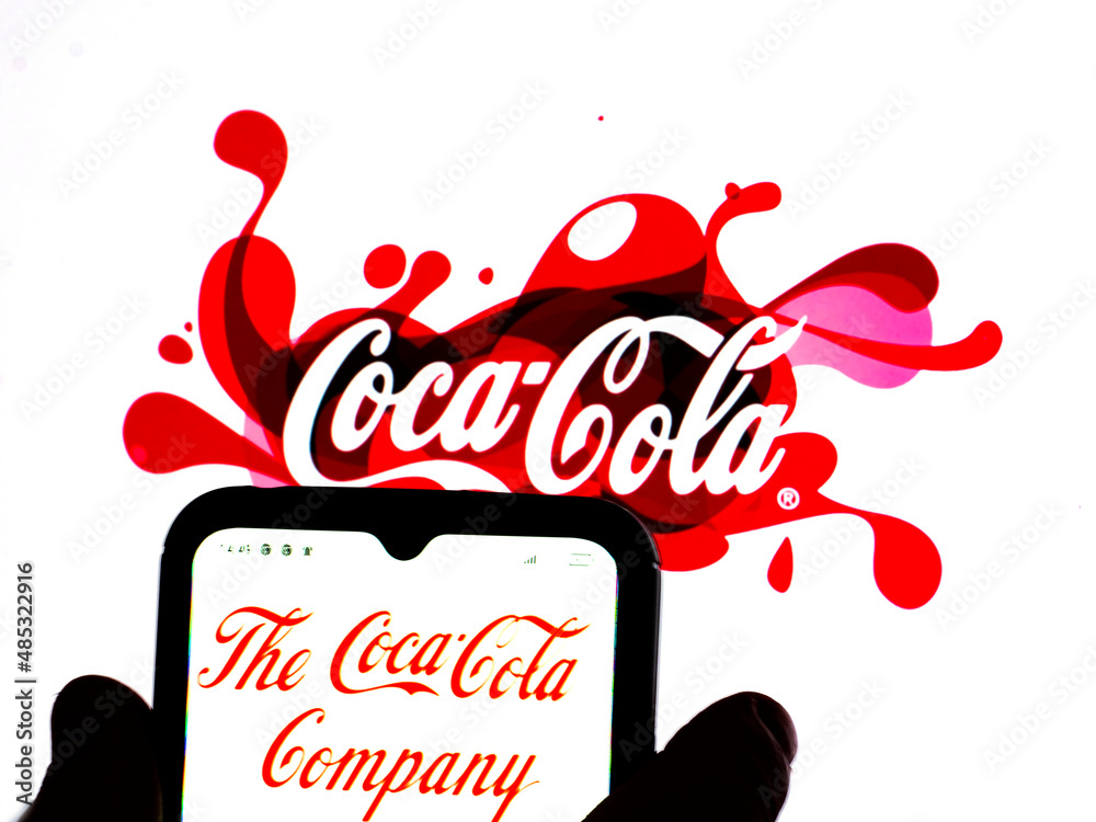 In this photo illustration, the Coca-Cola Company logo is displayed on ...