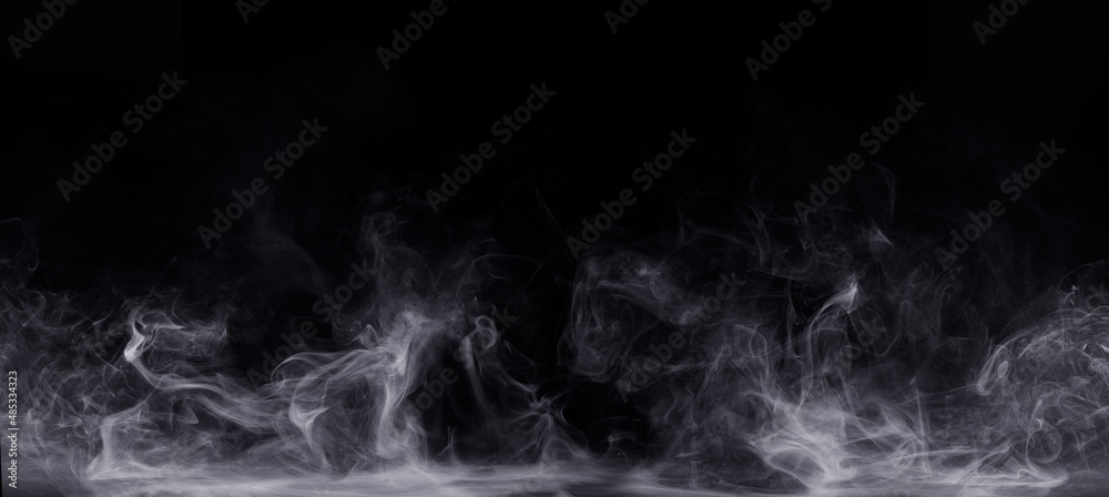 Abstract colored smoke moves on black background. Mystical swirling ...