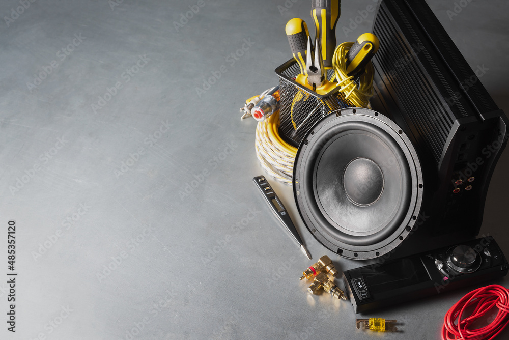 Car audio stereo system equipment on the workbench background with copy ...