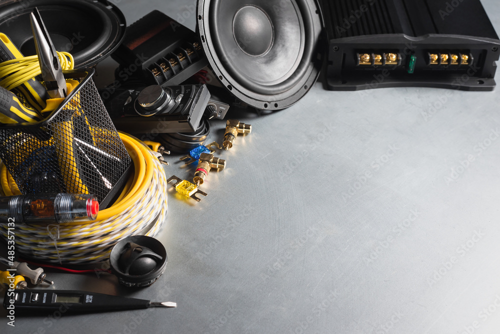 Car audio stereo system equipment on the workbench background with copy ...