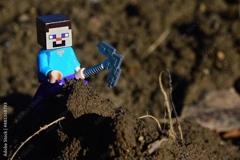LEGO Minecraft Steve figure in blue pullover walking with iron pickaxe ...