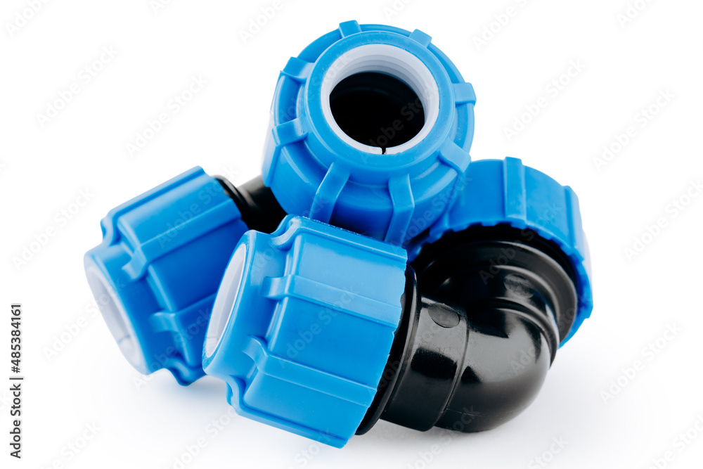Various plastic fittings for polypropylene pipes on white insulated ...
