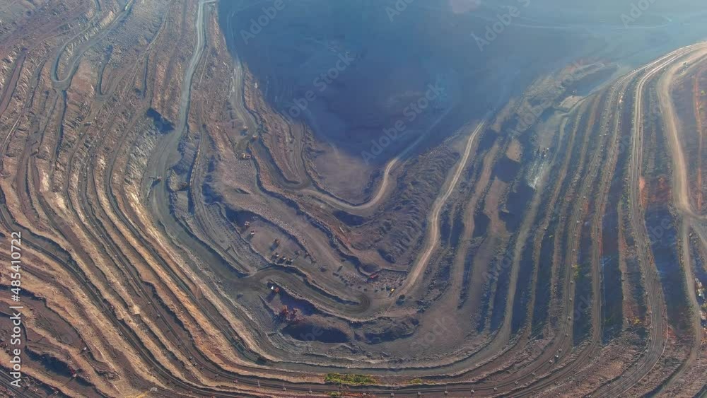 Open pit mining for steel production. A giant iron ore quarry. Aerial ...
