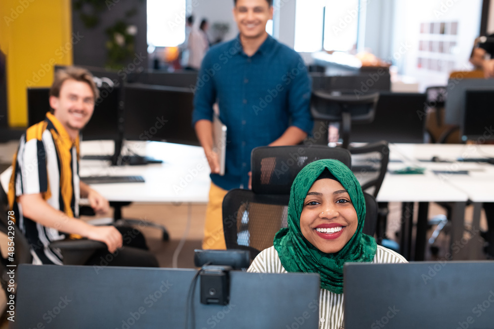 Multiethnic startup business team Arabian woman wearing a hijab on ...