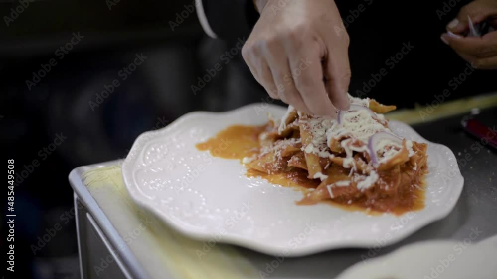 Chef sou-chef cook preparing a traditional mexican dish called ...