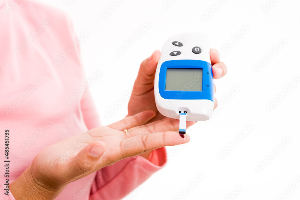 Closeup hands woman measur glucose test level check with blood on ...