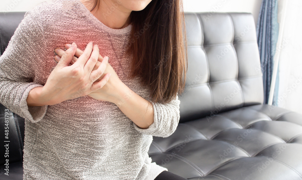 Asian beautiful Women touch chest heart attack symptom. Pain from heart ...