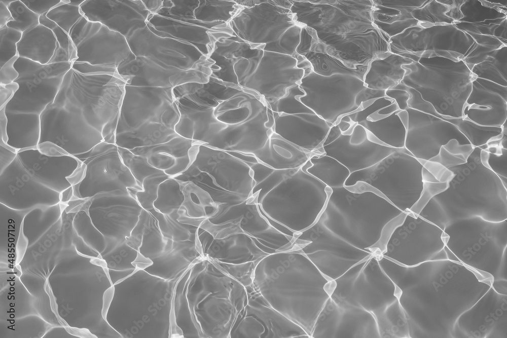Gray water surface with bright sun light reflections, Black and white ...