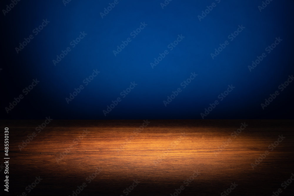 Spotlight on wooden board table top and blue background. Spotlight ...