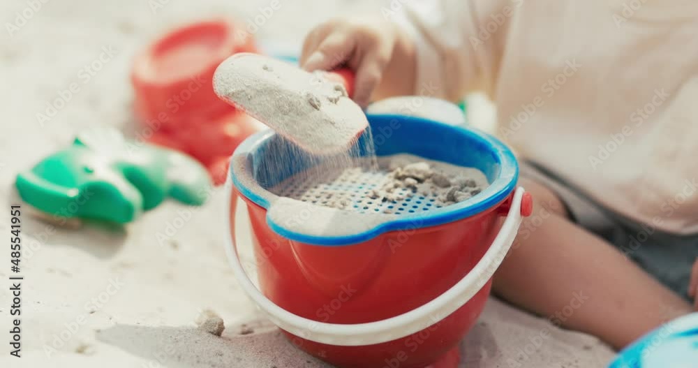 A child plays in the sandbox, a little boy spends his childhood in the ...