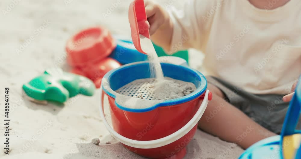 A child plays in the sandbox, a little boy spends his childhood in the ...