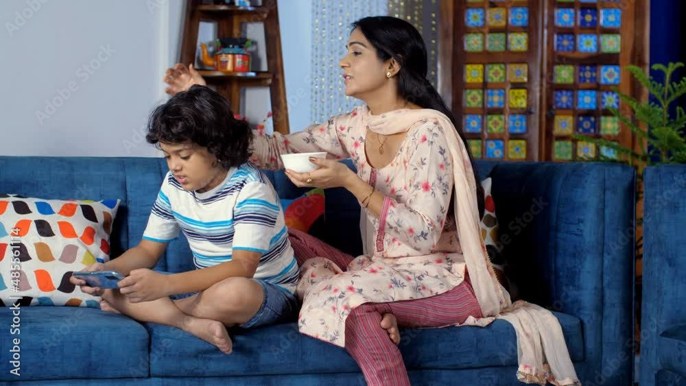 A Caring Mother Oiling The Curly Hair Of Her Adorable Son Healthy