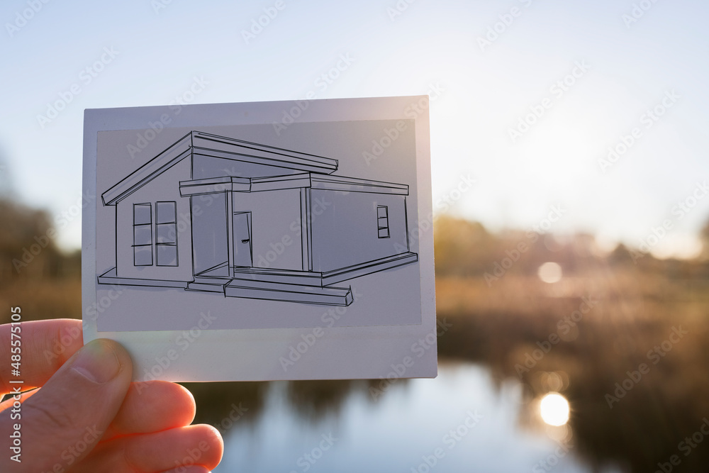 Hand holding drawing of house Stock Photo | Adobe Stock