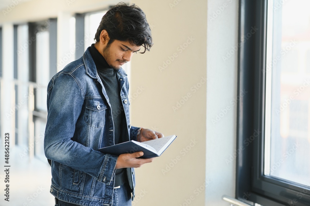 indian guy student at university. Stock Photo | Adobe Stock