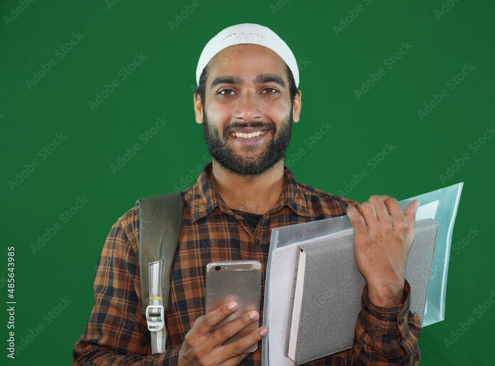 Young student muslim boy with books on Green screen background. Stock ...