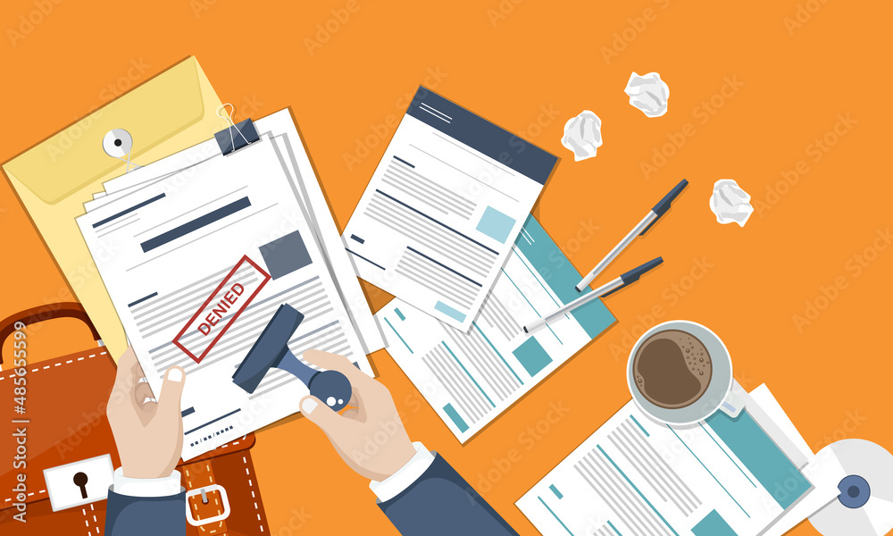 Hand stamps paper document with rejected stamp. Rejected document on ...