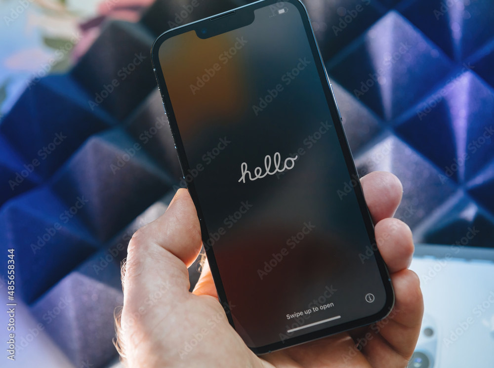 Paris, France - Sep 25, 2021: POV male hand holding new iPhone 13 Pro ...