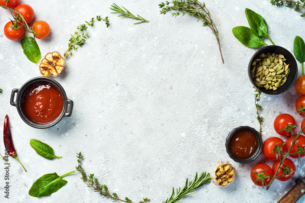 Gray stone cooking background. Spices and vegetables. Top view. Free ...