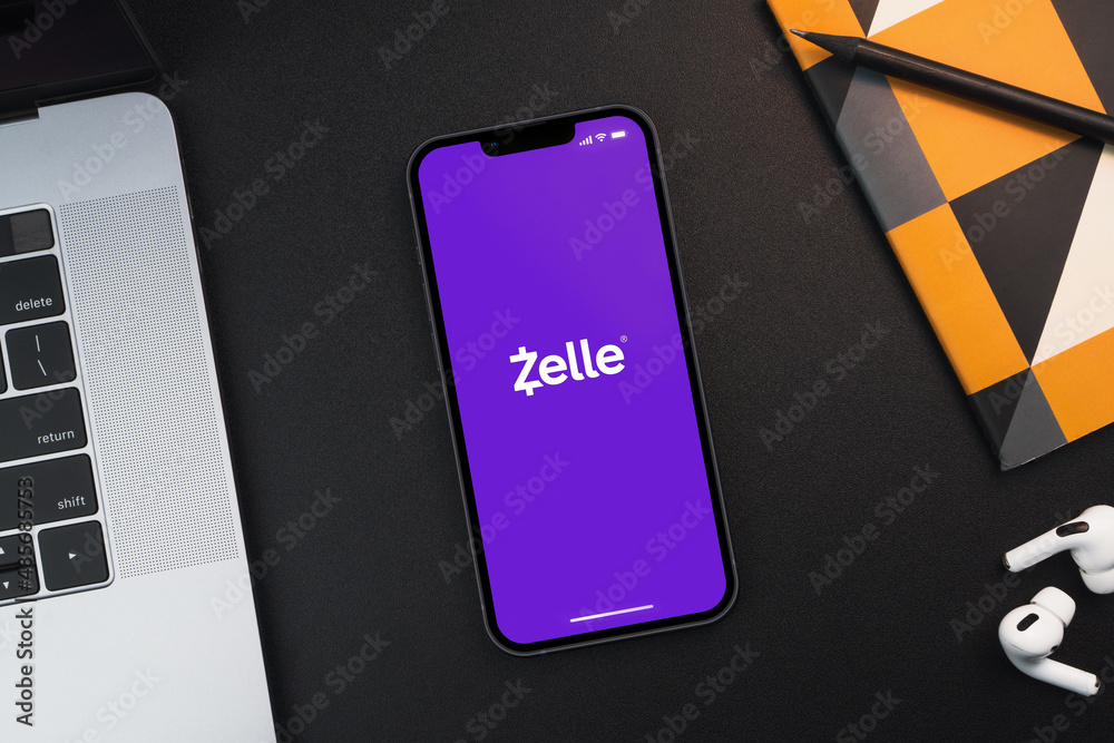 Zelle app on the smartphone screen on black background table. Office ...