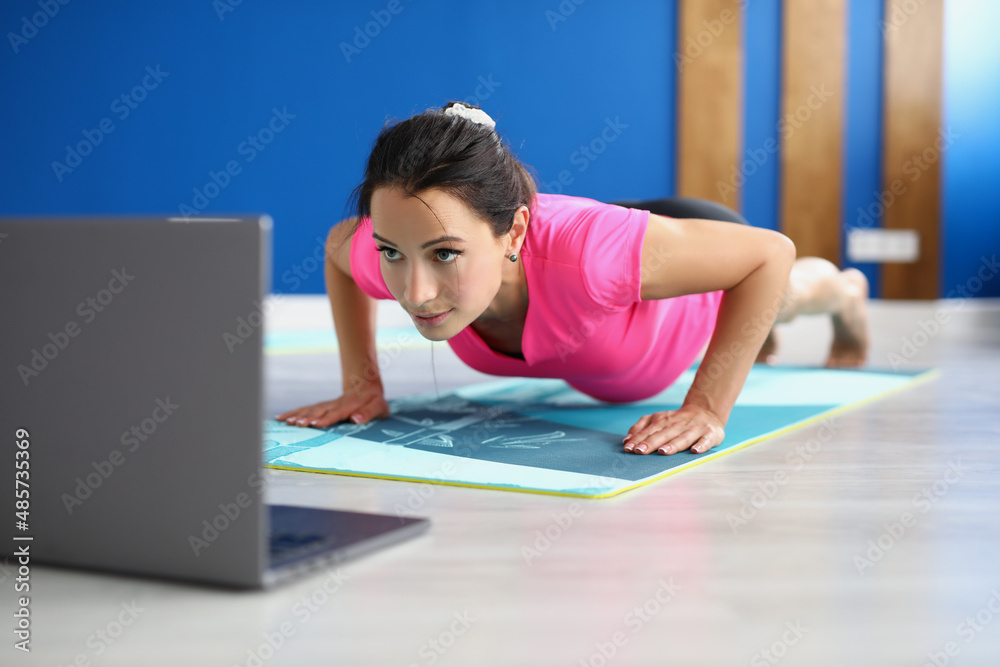 Concentrated woman exercise for full body, active train in studio Stock ...