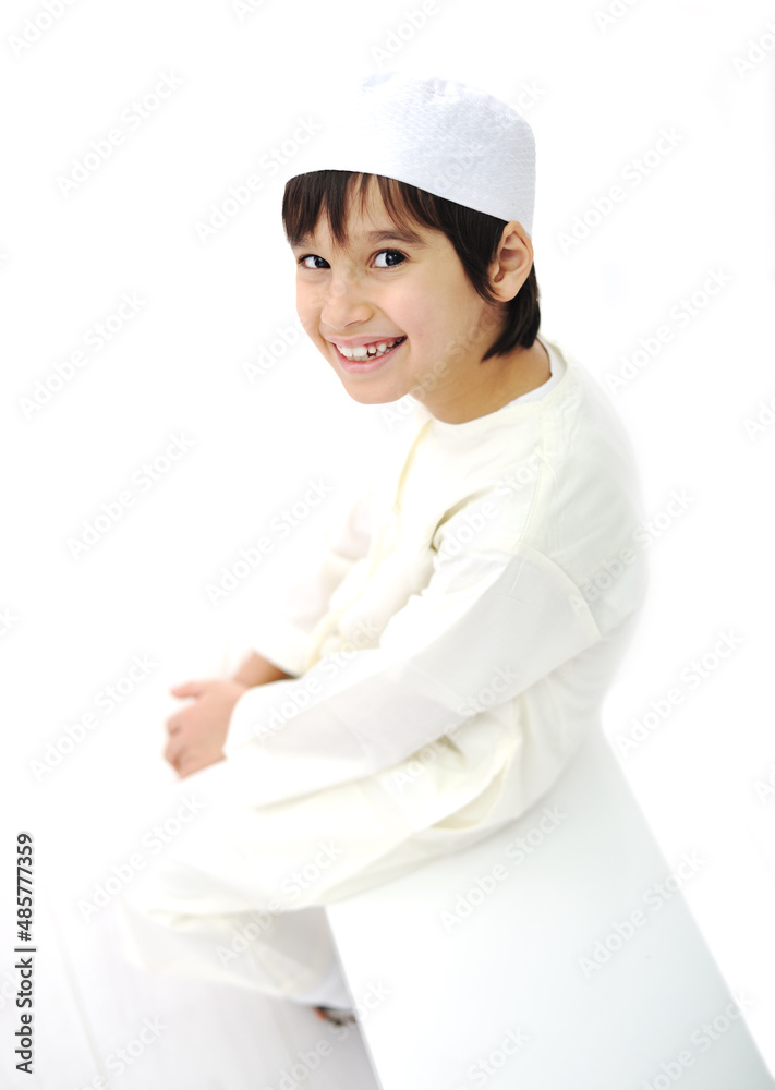 Little Arabic Muslim kid sitting indoor Stock Photo | Adobe Stock