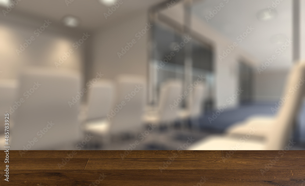 Front view of an office interior with a row of dark wood tables ...